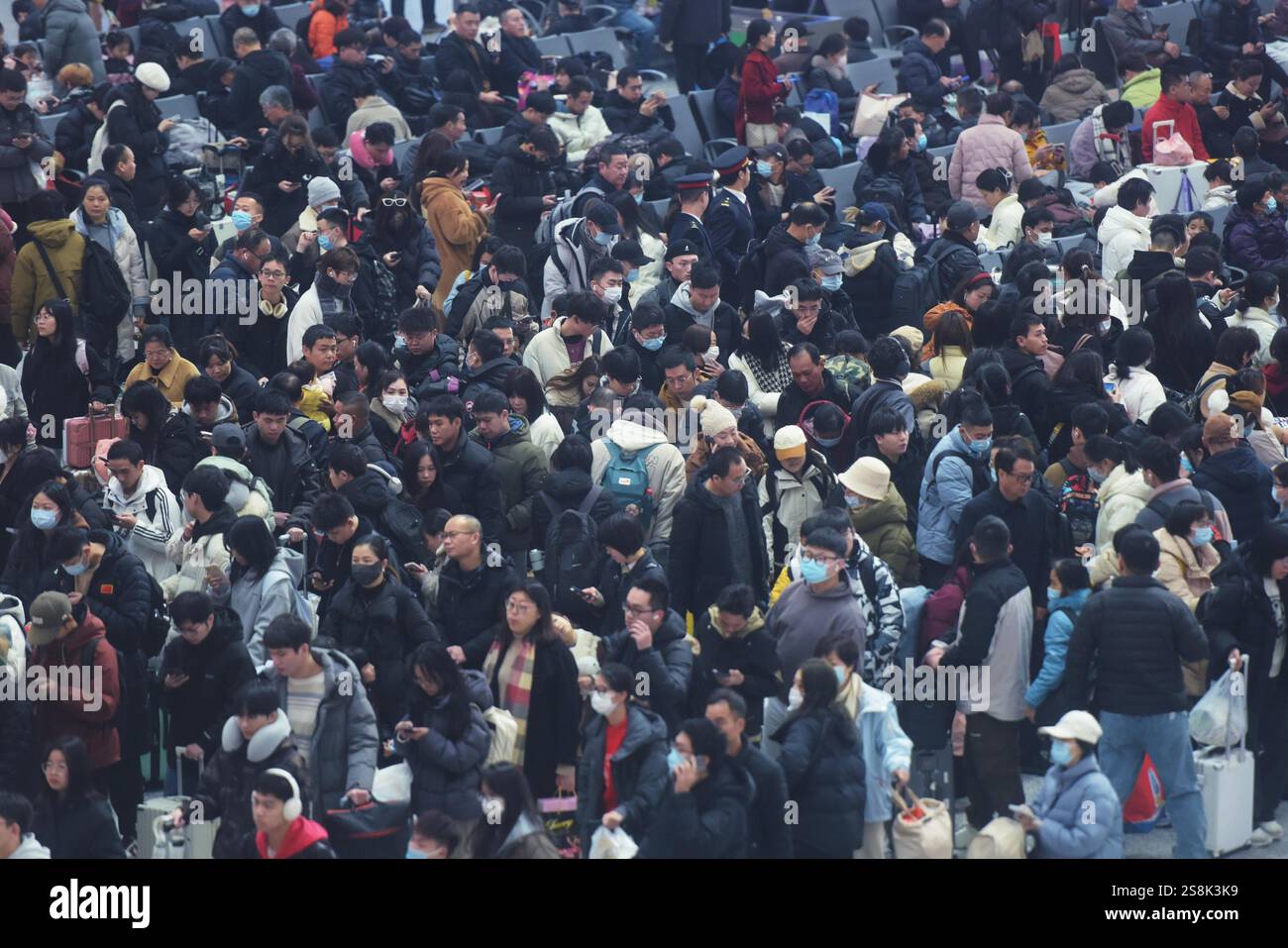 Passengers wait for trains at Hangzhoudong railway station in Hangzhou ...
