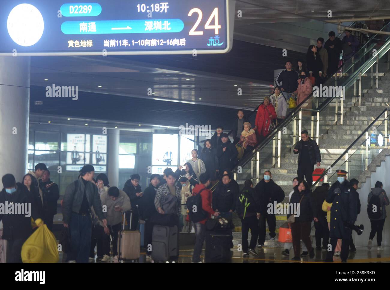 Passengers wait for trains at Hangzhoudong railway station in Hangzhou ...