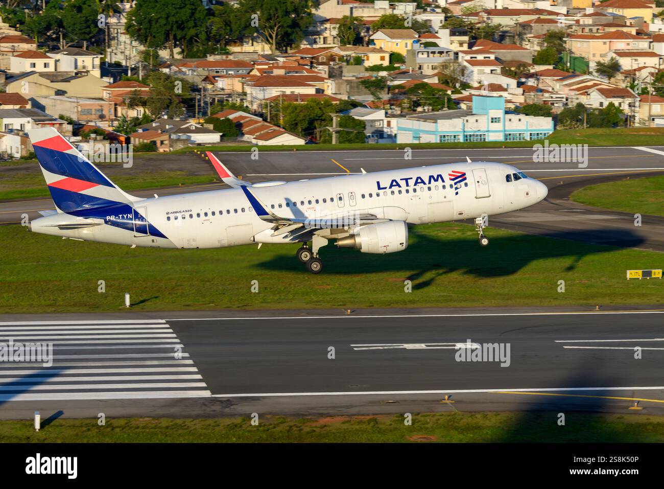 Aircraft of LATAM Airlines Brazil of model A320 landing. LATAM Airlines ...