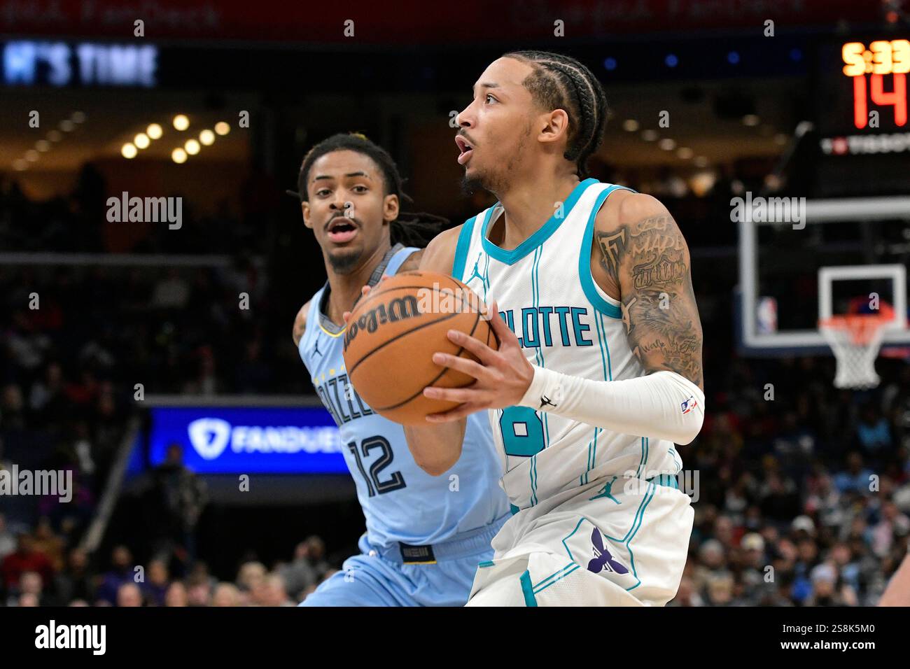 Charlotte Hornets guard Nick Smith Jr. (8) handles the ball ahead of ...