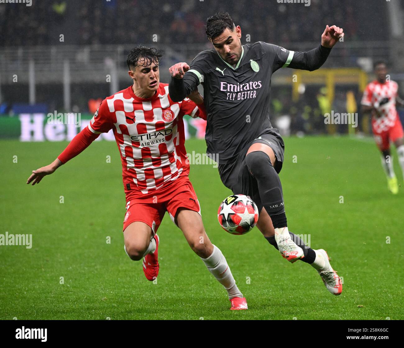 Milan, Italy. 22nd Jan, 2025. AC Milan's Theo Hernandez (R) vies with ...