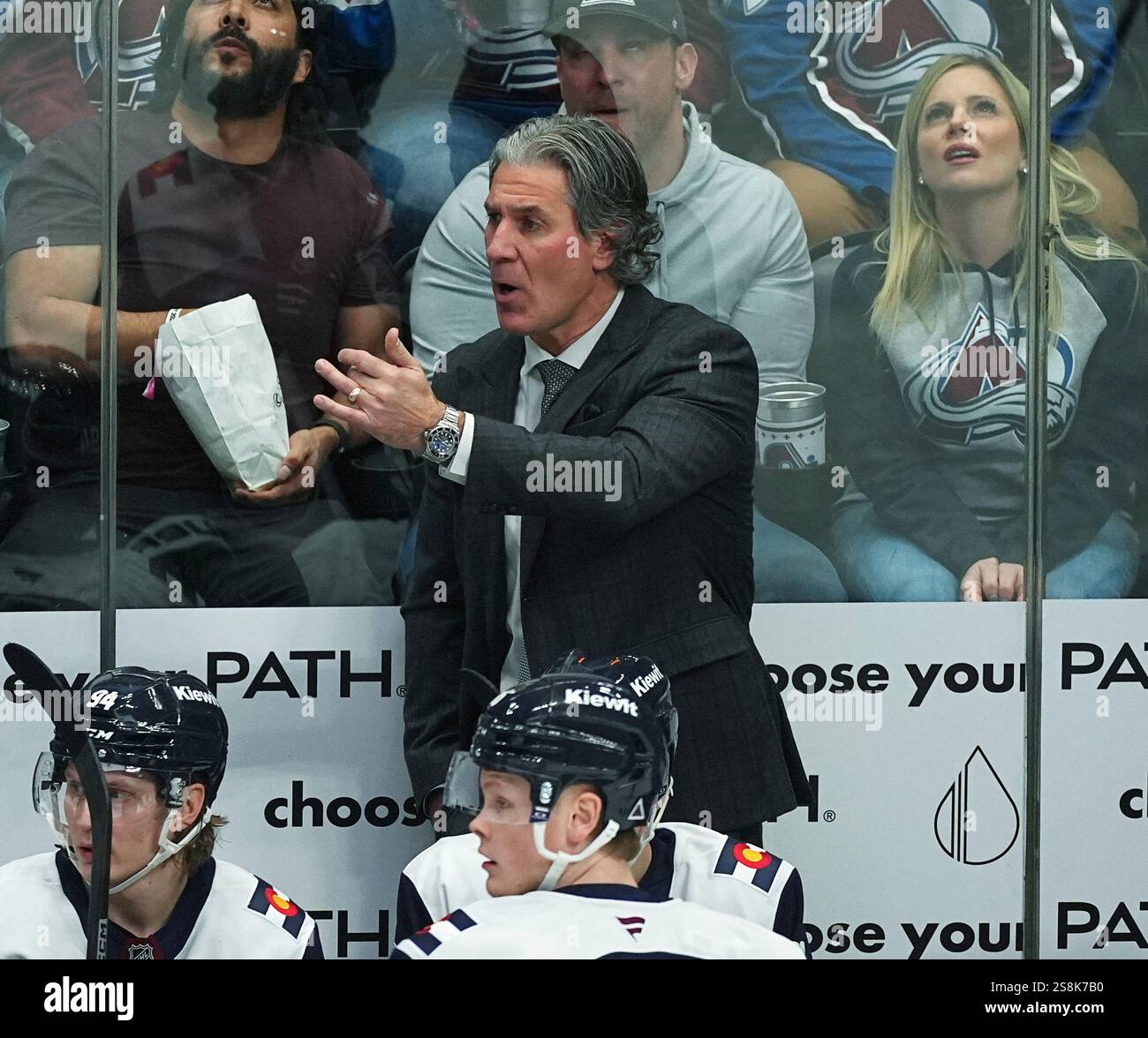 Colorado Avalanche head coach Jared Bednar, back, directs his team ...