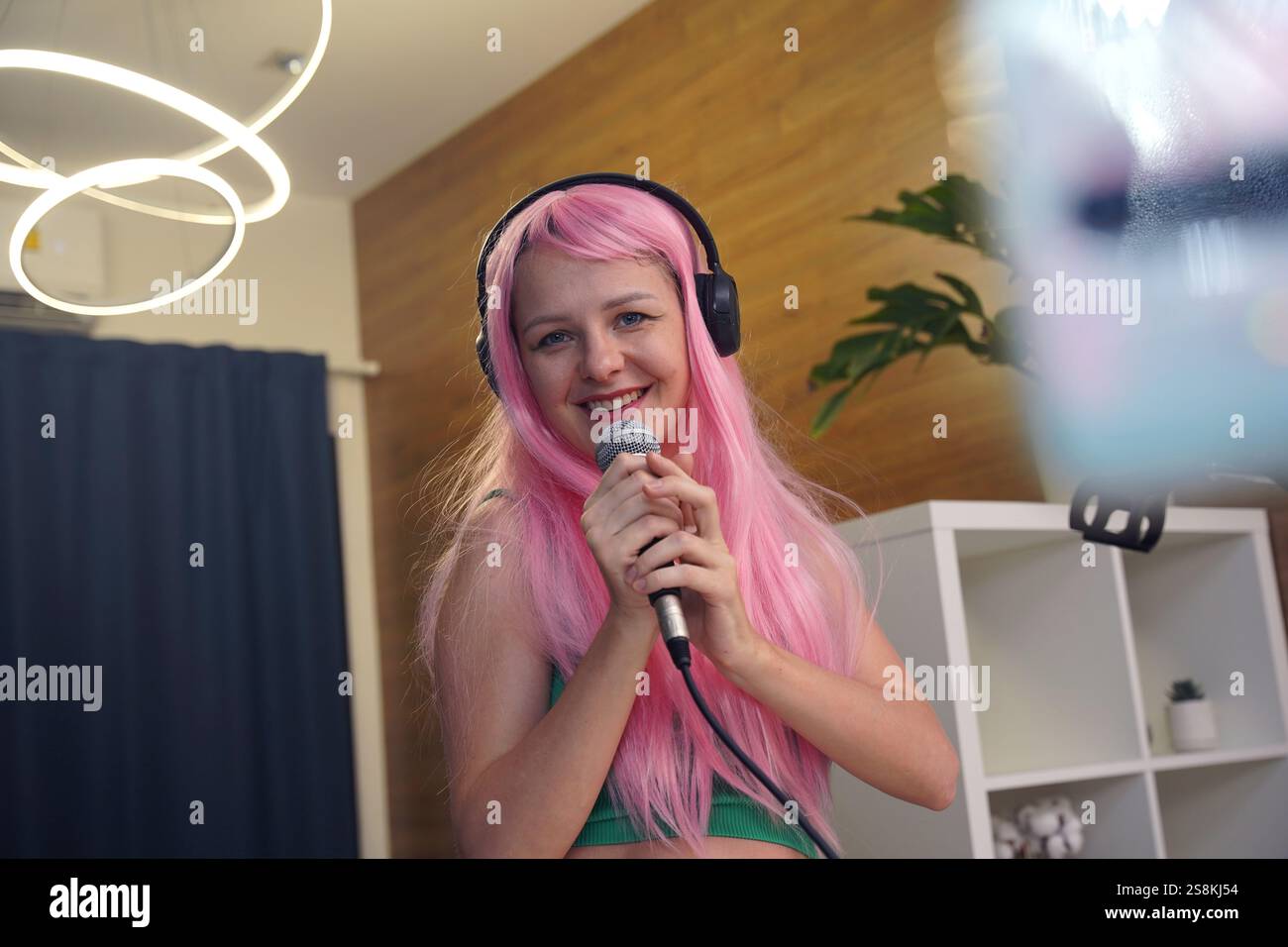 Beautiful young singer and musician broadcast from her home studio ...