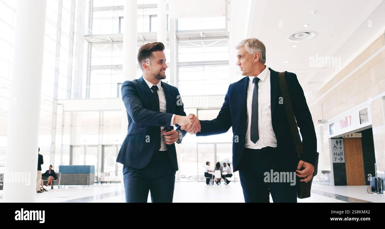 Business, people and handshake in lobby for welcome, greeting or CEO ...