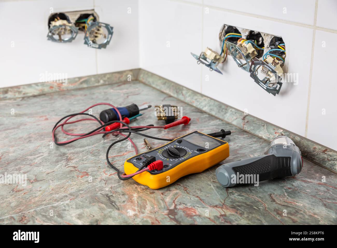 Fixing and repairing broken outlets and socket with tools and ammeter ...