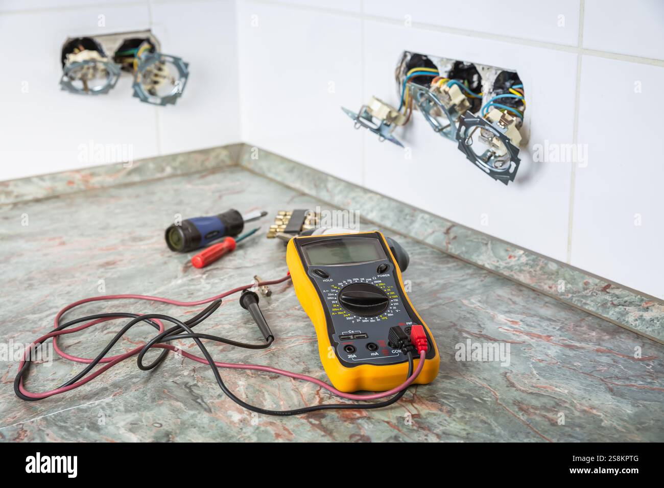 Fixing and repairing broken outlets and socket with tools and ammeter ...