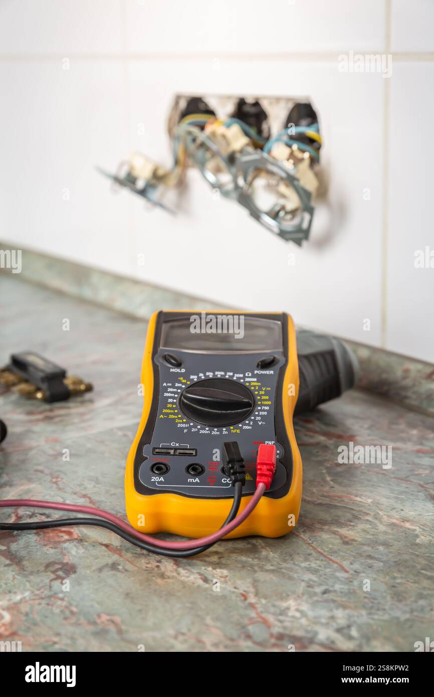 Fixing and repairing broken outlets and socket with tools and ammeter ...