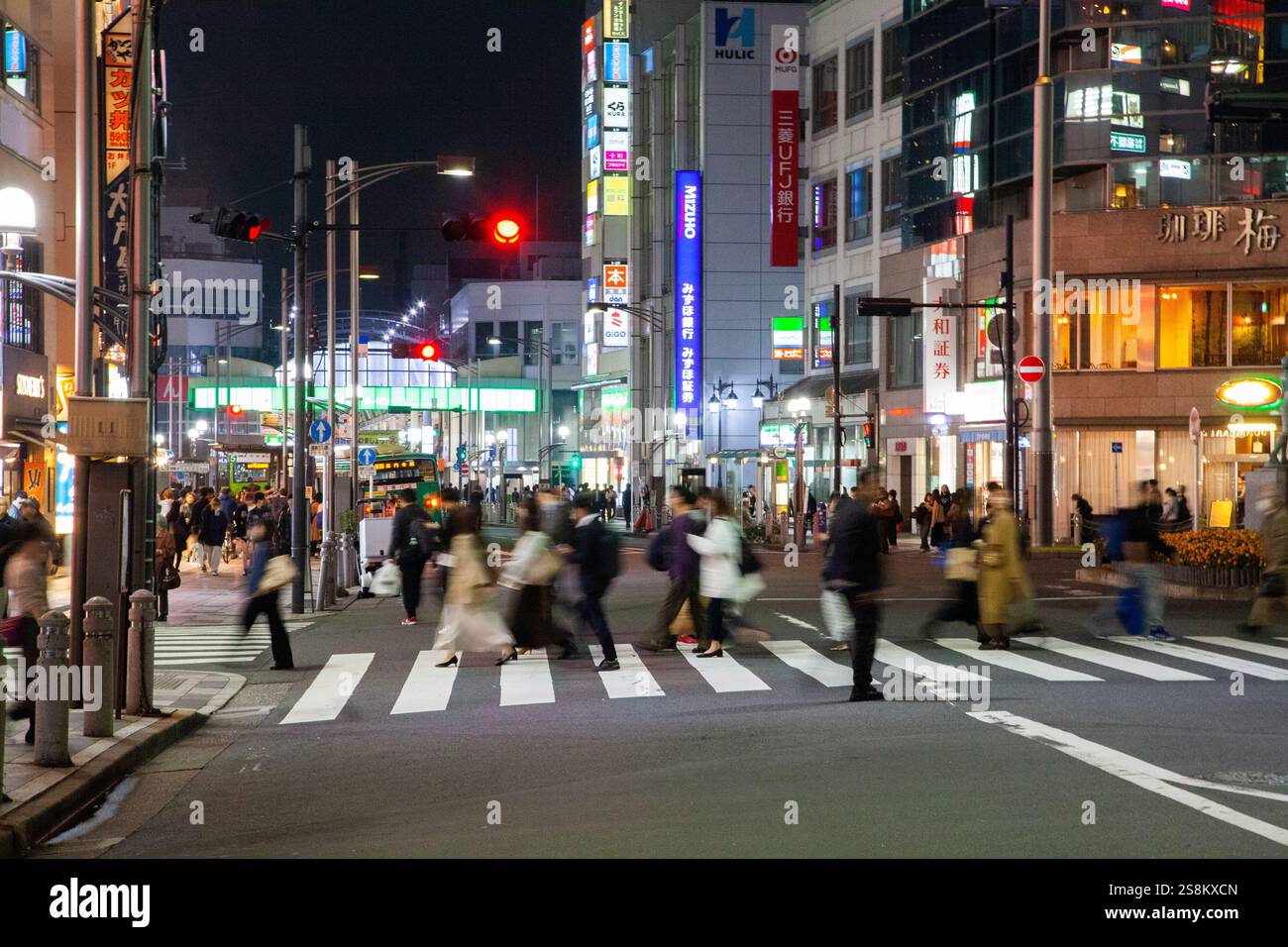 A road in Akabane, Tokyo near Akabane train station at night with ...