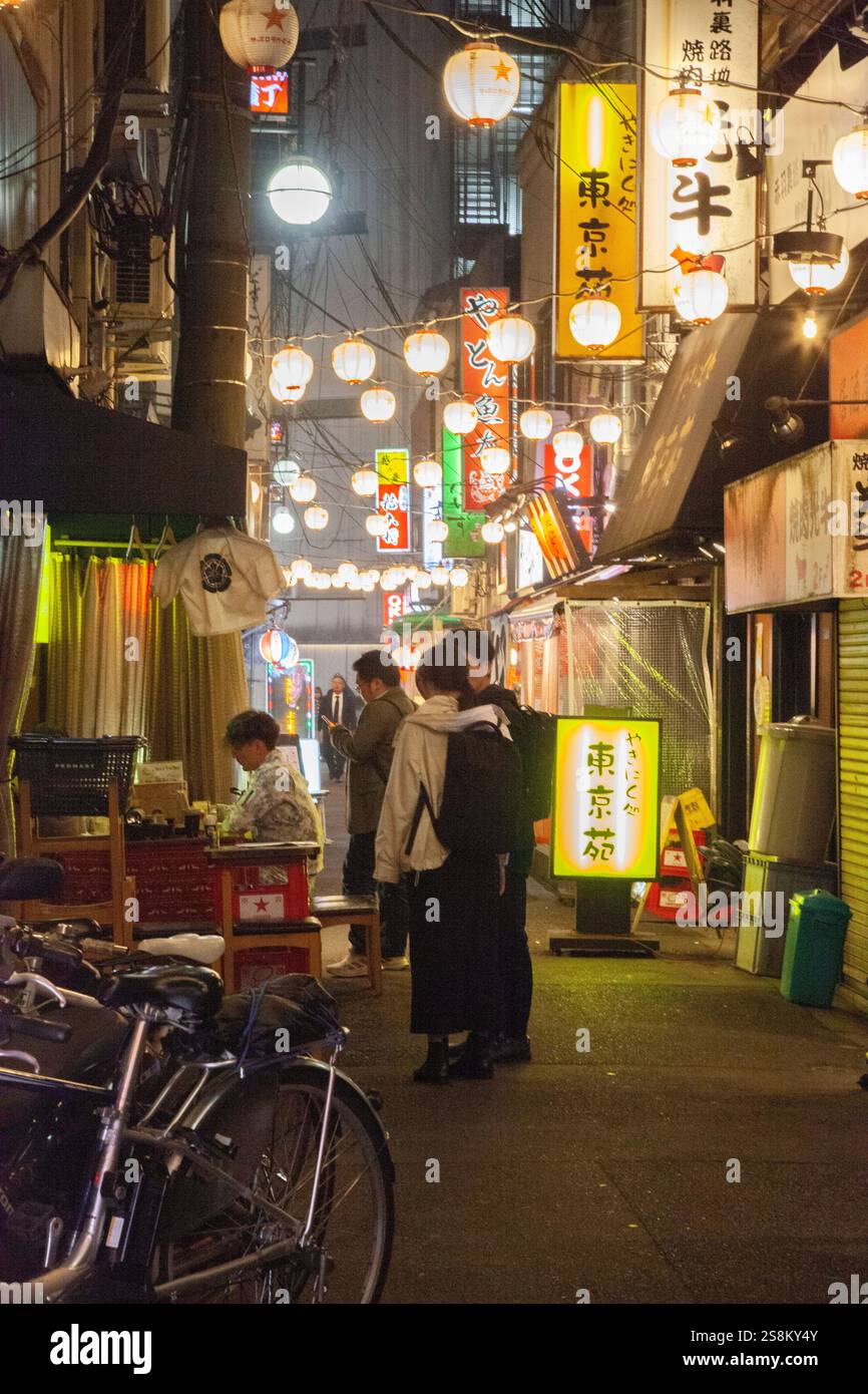 A Japanese alley at night with restaurants and bars in the Akabane ...