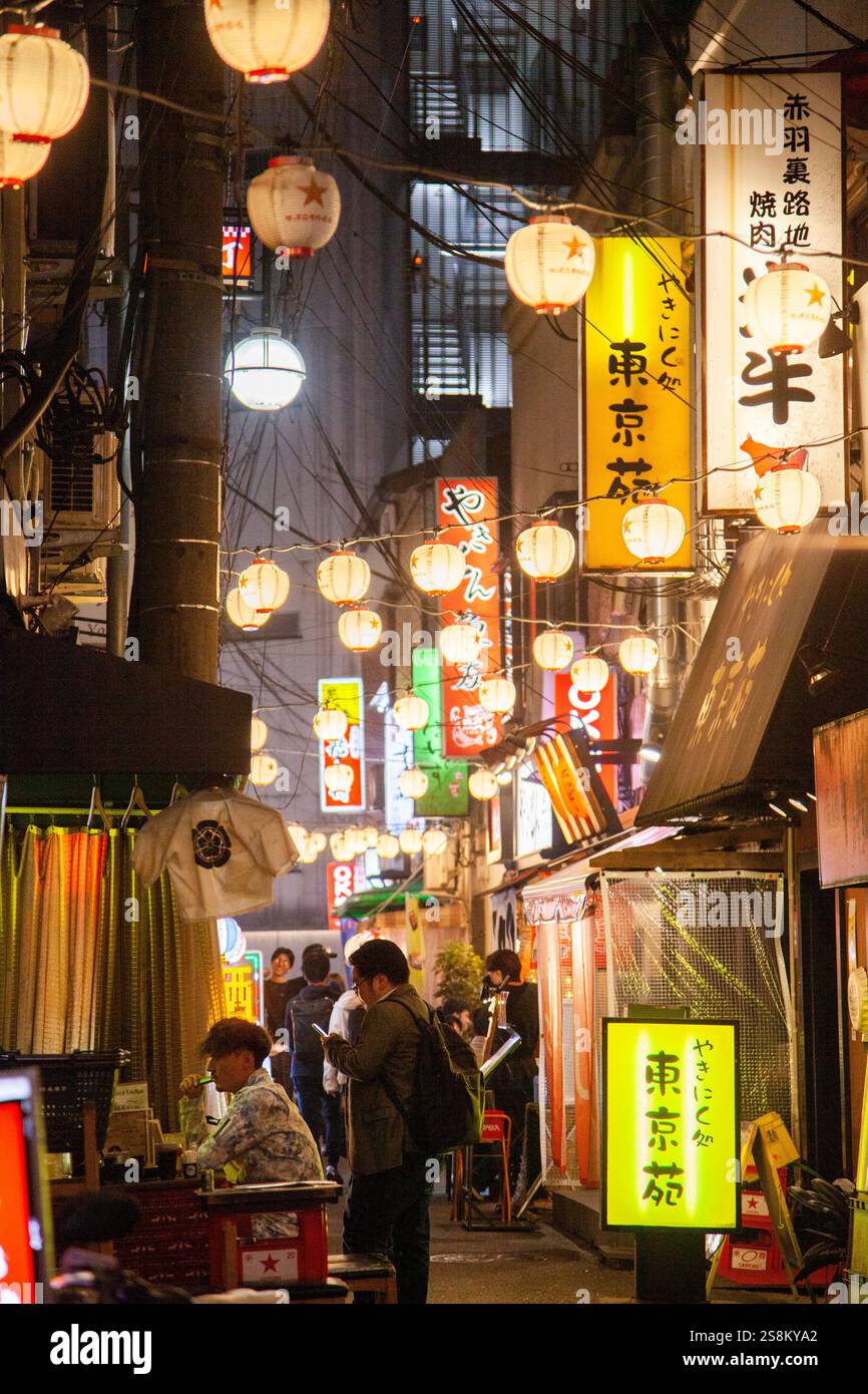 A Japanese alley at night with restaurants and bars in the Akabane ...