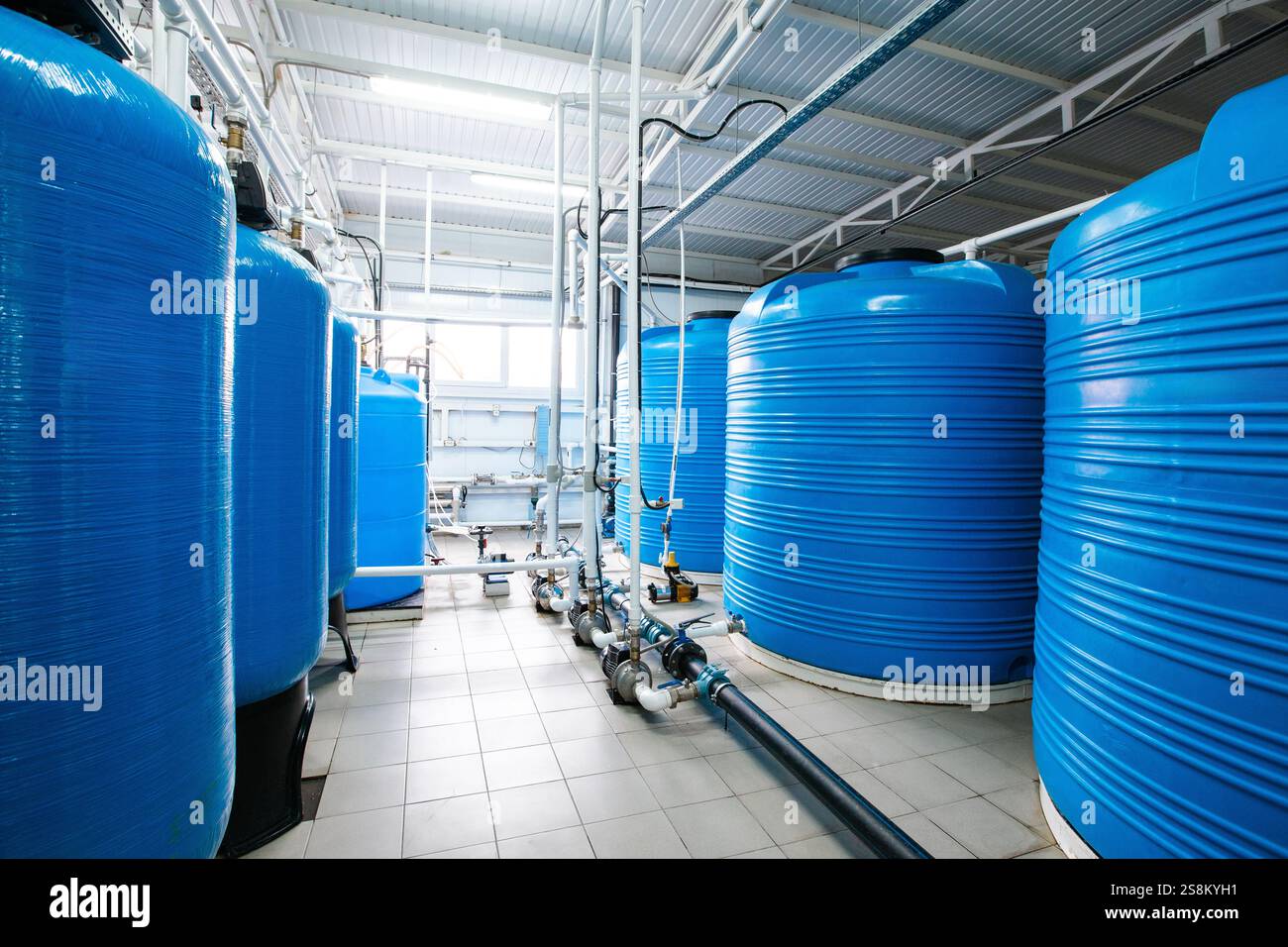 Blue tanks in a modern industrial facility for water treatment ...