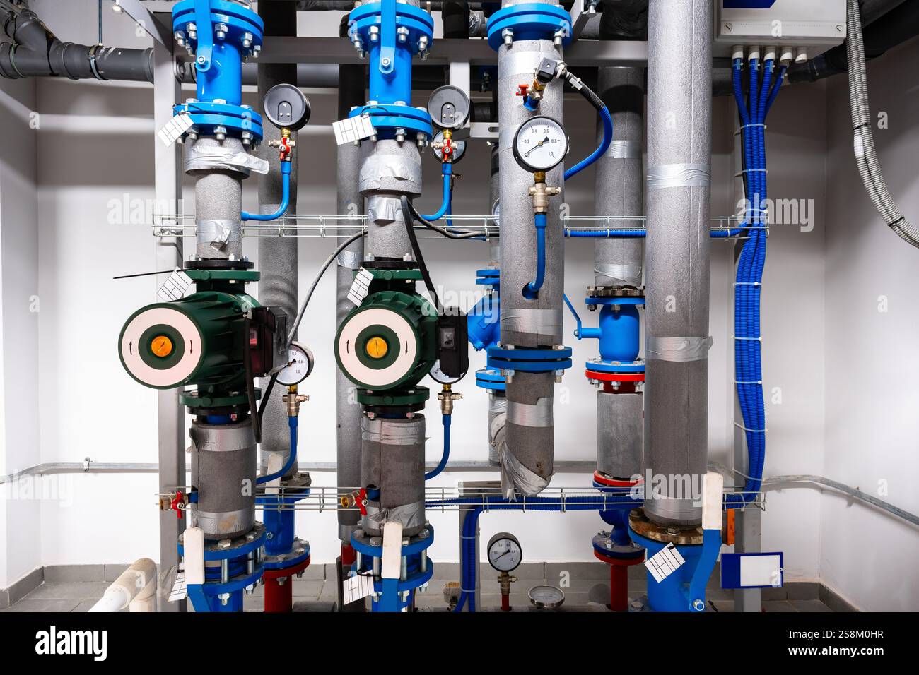Industrial water pumping system showcasing blue and green components in ...