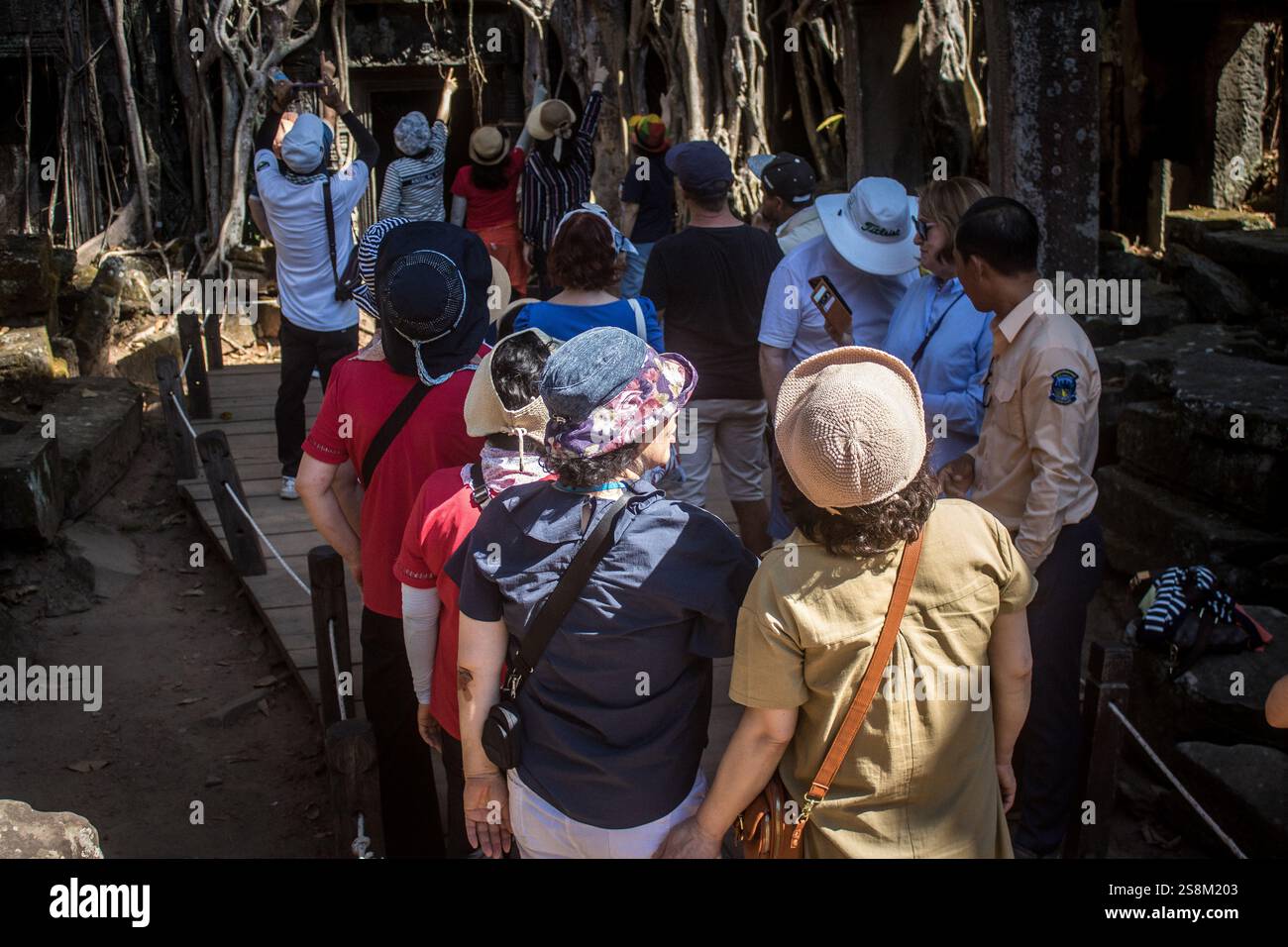 Siem reap, Cambodia, January 21, 2025 Tourists visiting Ta Prohm temple ...