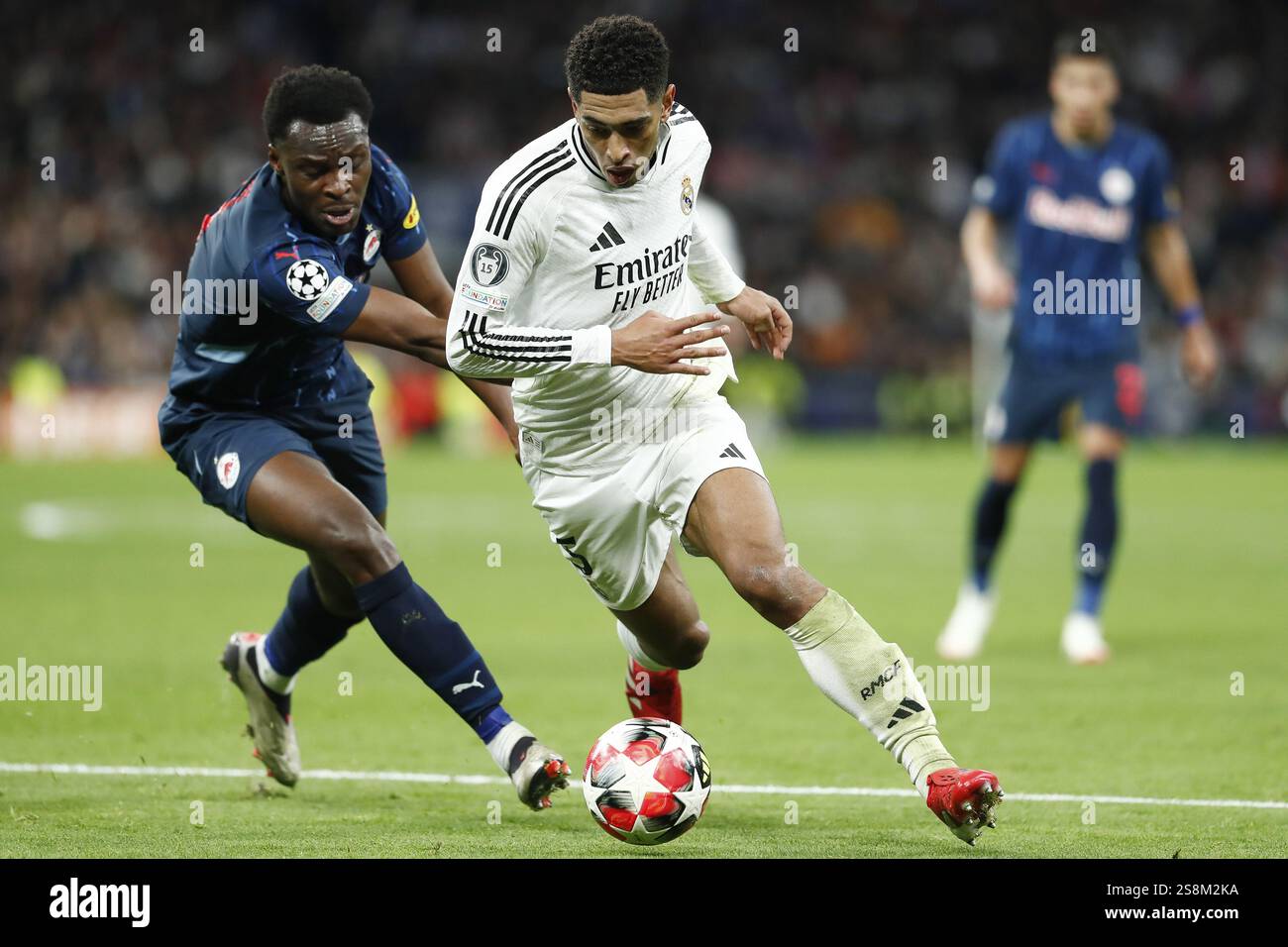 Jude Bellingham of Real Madrid and Samson Baidoo of RB Salzburg during ...