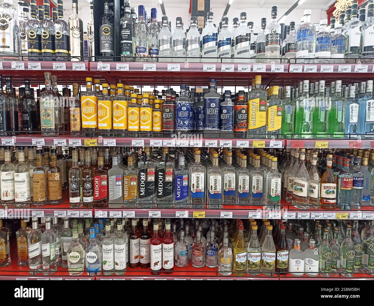 Assorted vodka bottles on store shelves in liquor aisle displaying ...