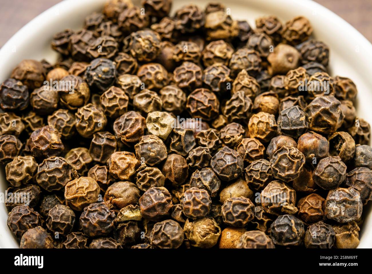 black pepper seeds, peppercorn spice close up, macro photo Stock Photo ...