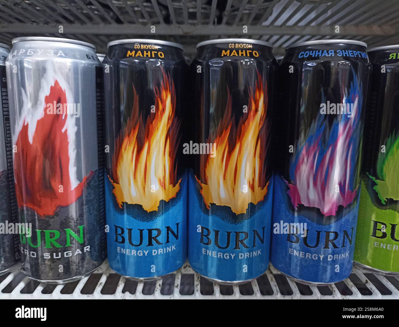Variety of burn energy drink cans displayed on a shelf Stock Photo - Alamy