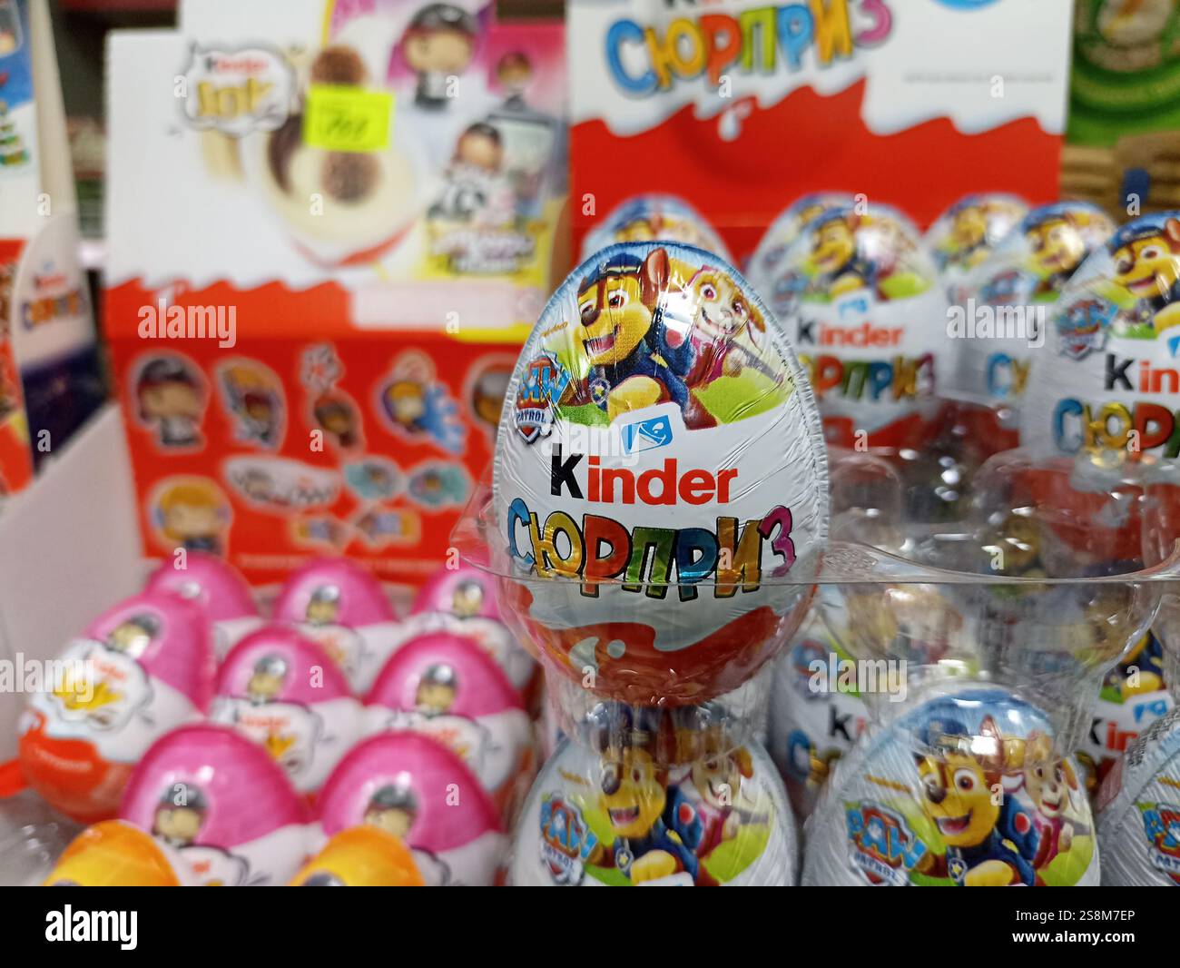 Kinder surprise eggs featuring animated characters in a retail display ...