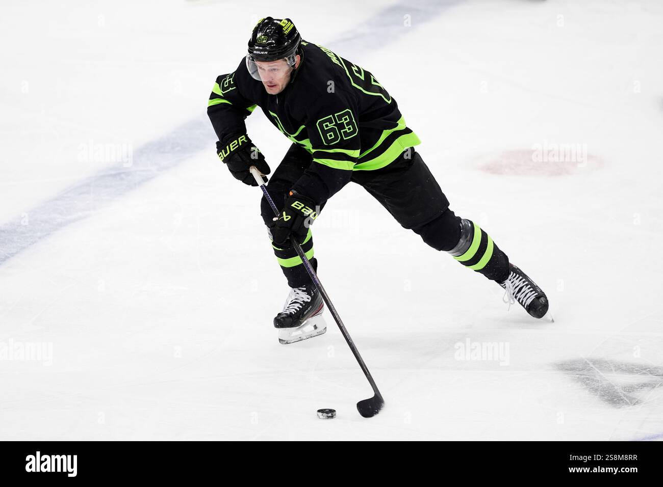 Dallas Stars right wing Evgenii Dadonov moves the puck against the ...
