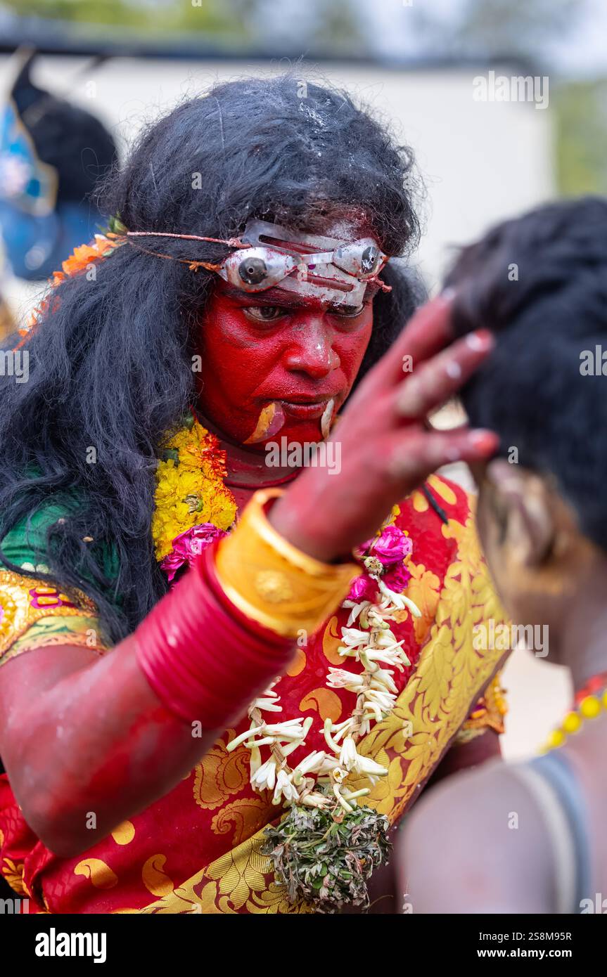 Kulasai, Portrait of indian hindu devotee with painted face and dressed ...
