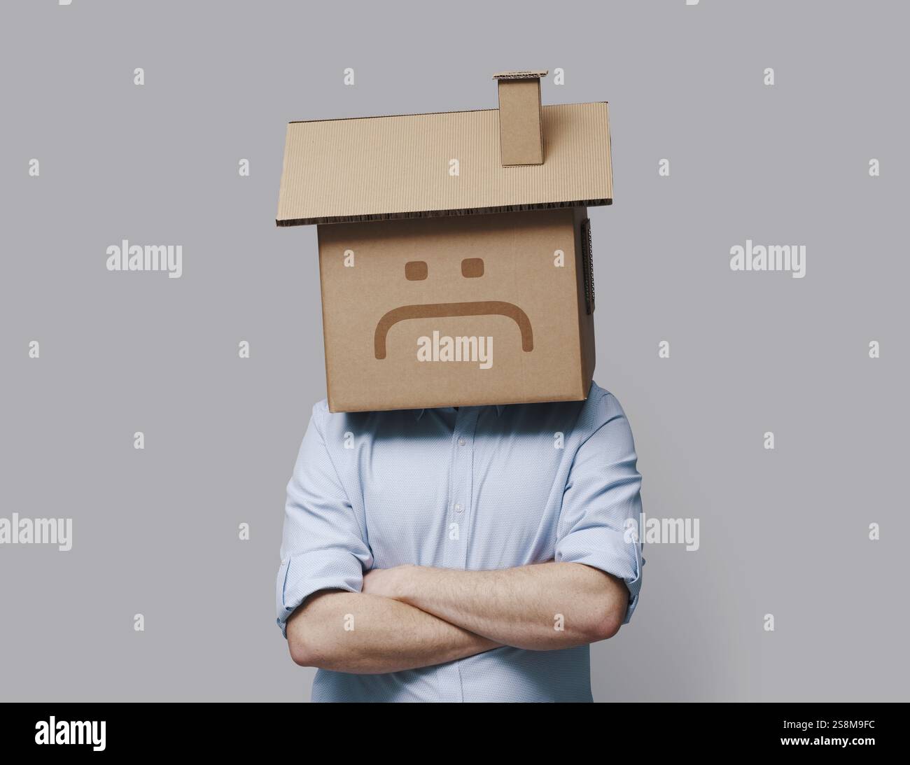 Sad disappointed man with cardboard house in place of his head: home ...