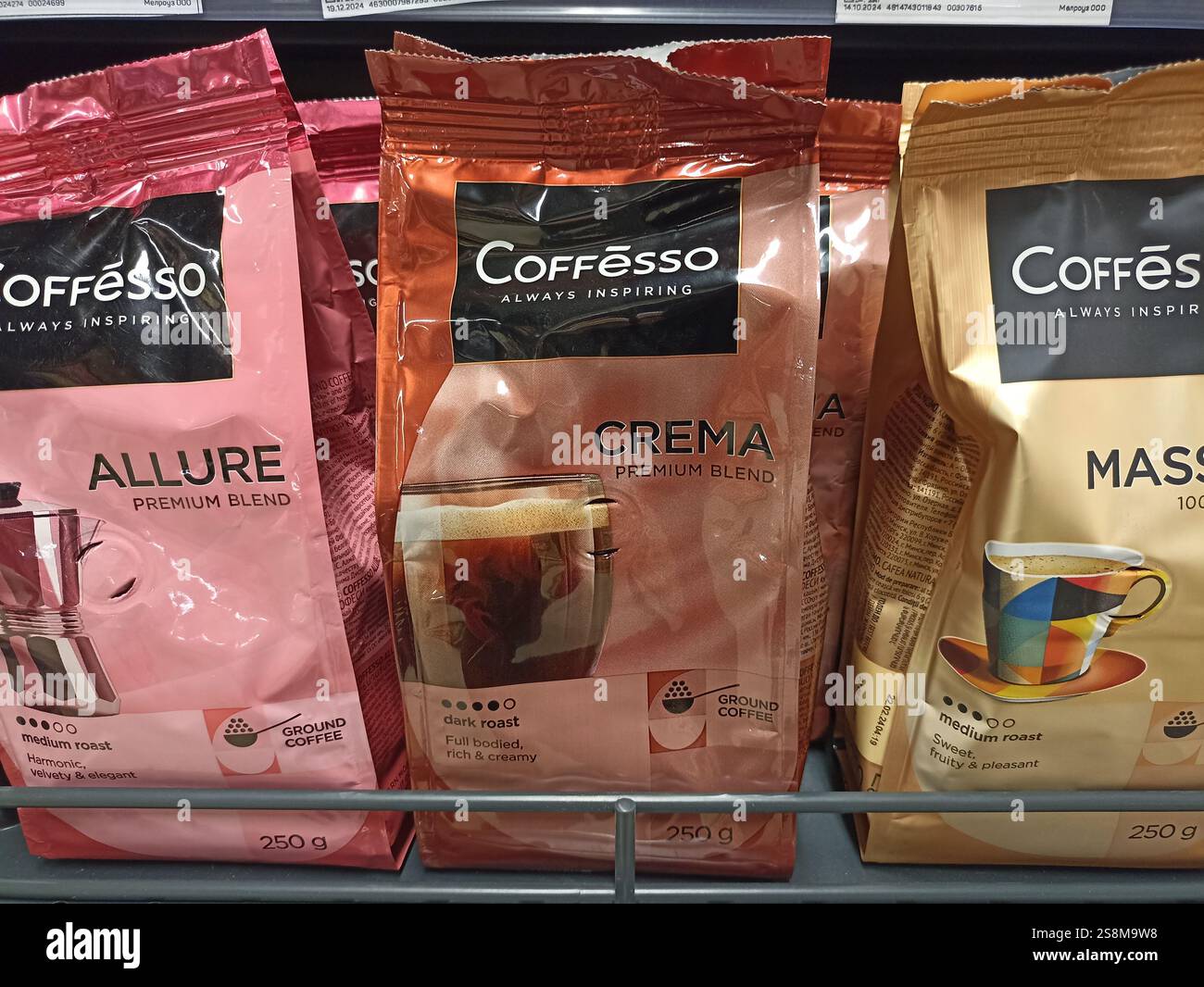 Coffee bags display on store shelf featuring coffesso premium blends ...
