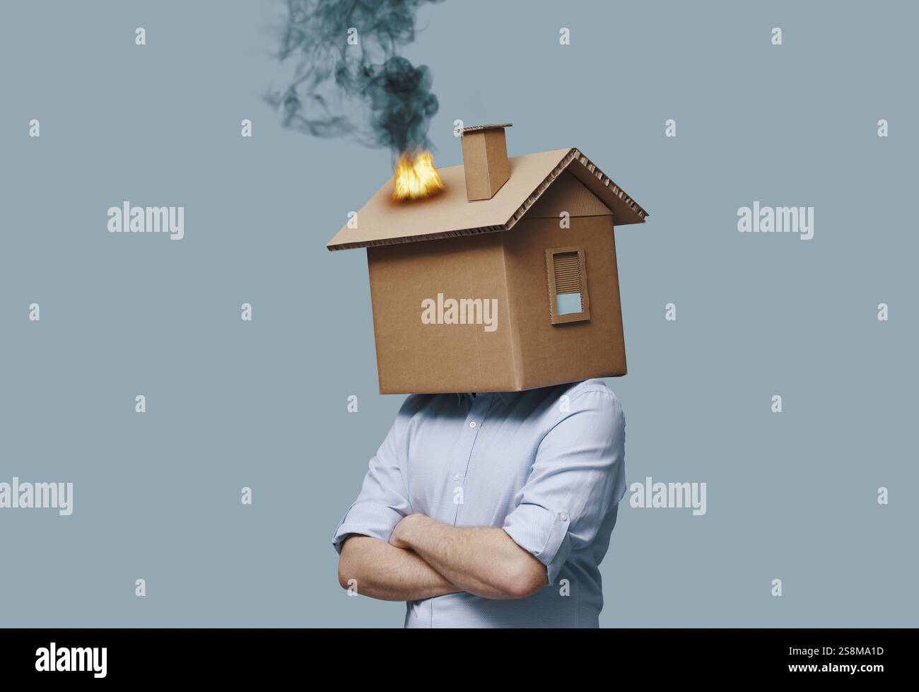 Homeowner with his head inside a burning cardboard house: property ...