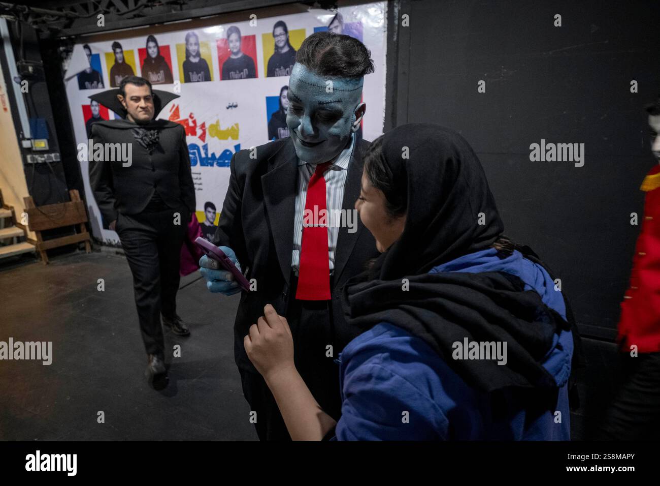 An Iranian actor is made up as Frankenstein, and a woman looks at a ...