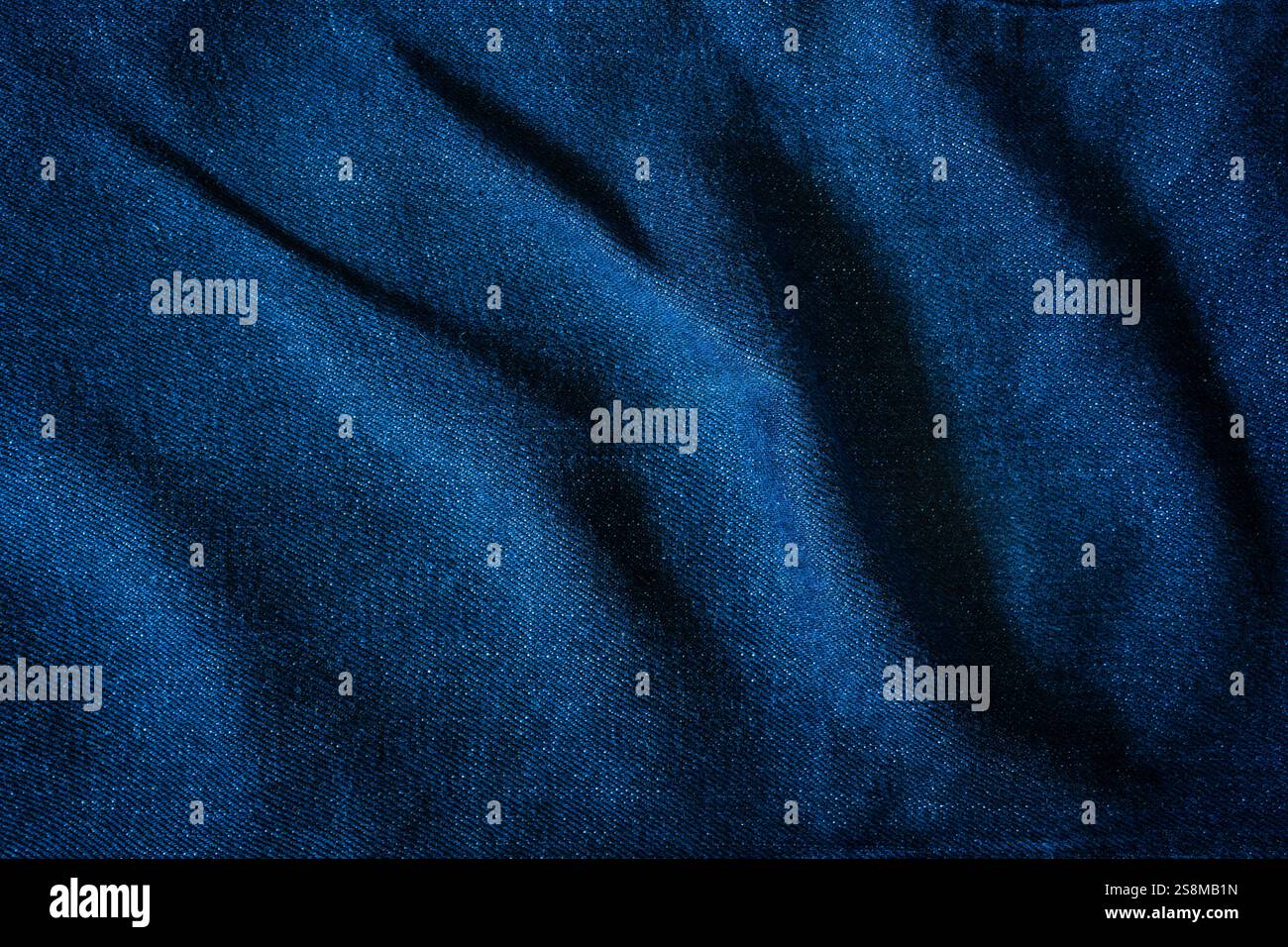 Deep Blue Denim with a Wrinkled Texture Stock Photo - Alamy