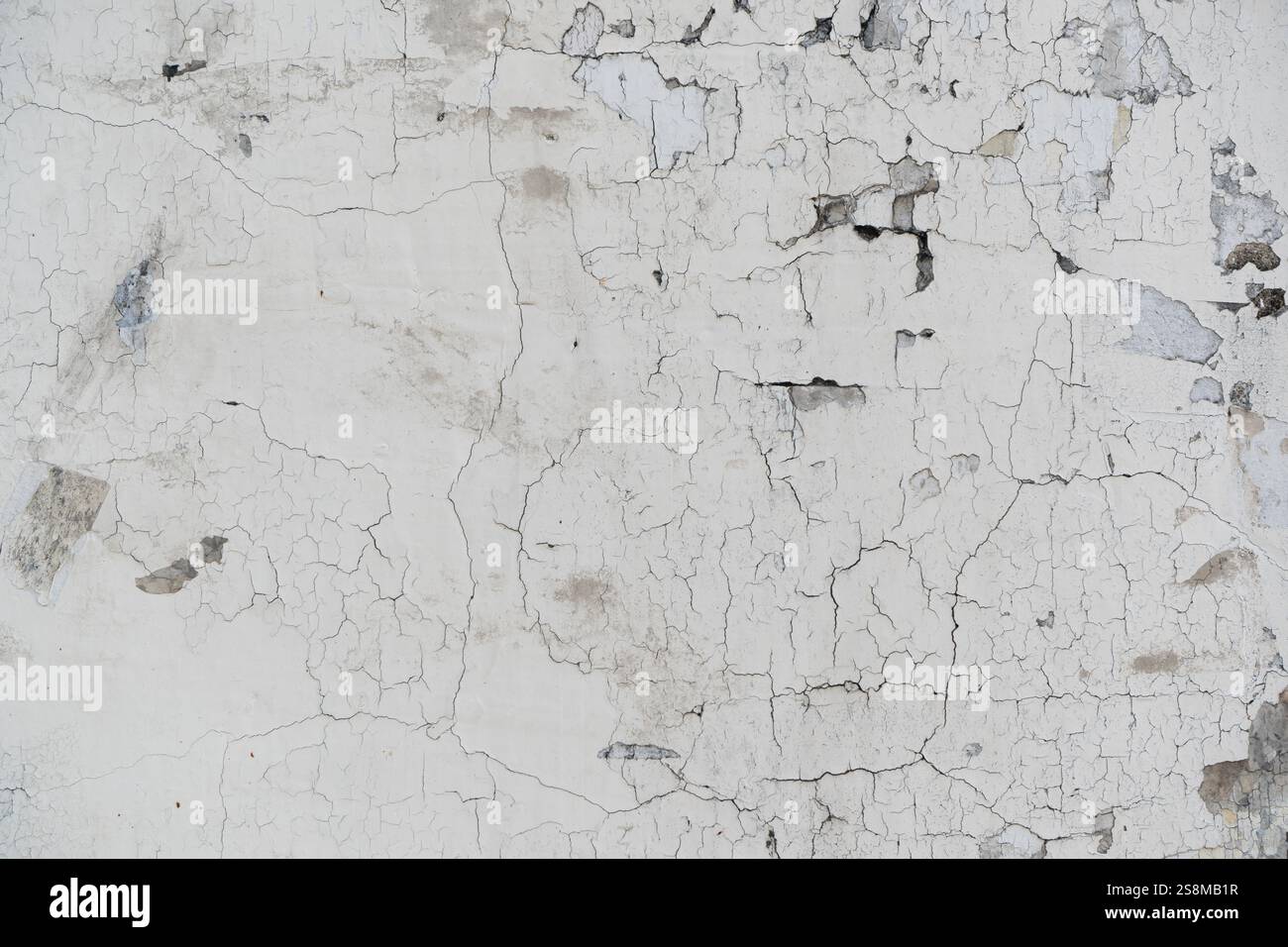 Cracked and Chipped White Paint on a Weathered Wall Stock Photo - Alamy