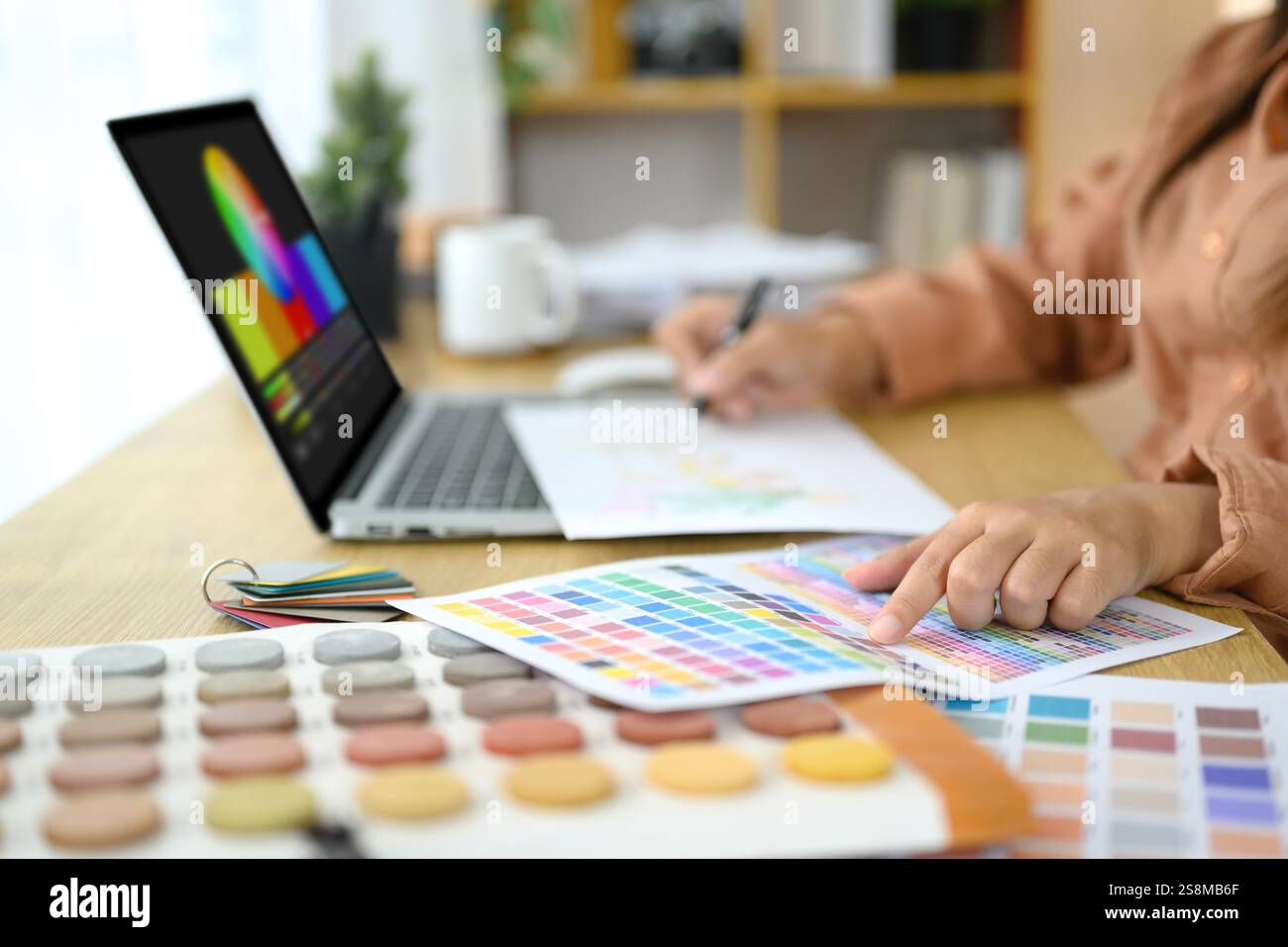 Close up of interior designer reviewing color swatches and design ...