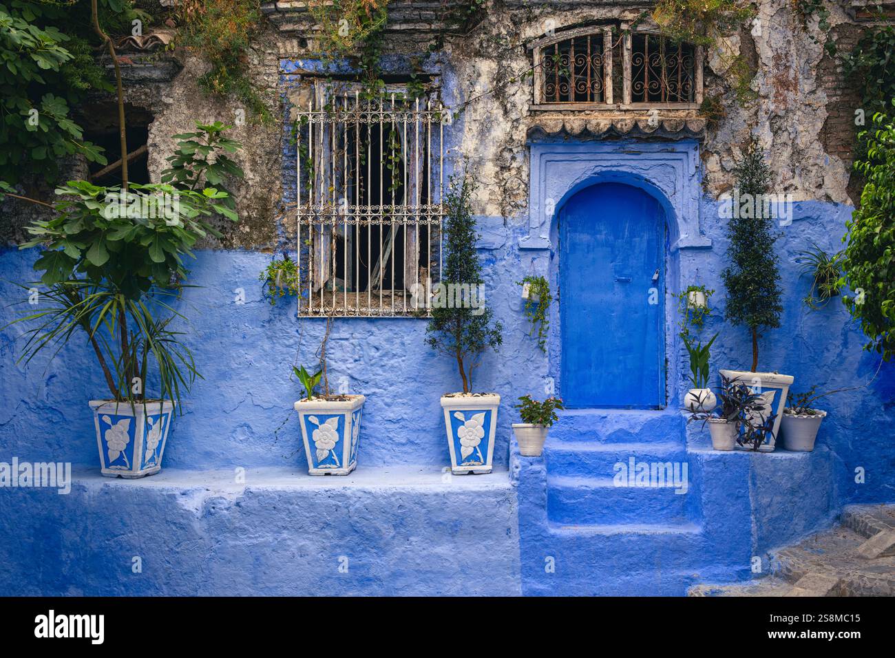 Facade of a partially destroyed blue house inside the Chefchaouen ...