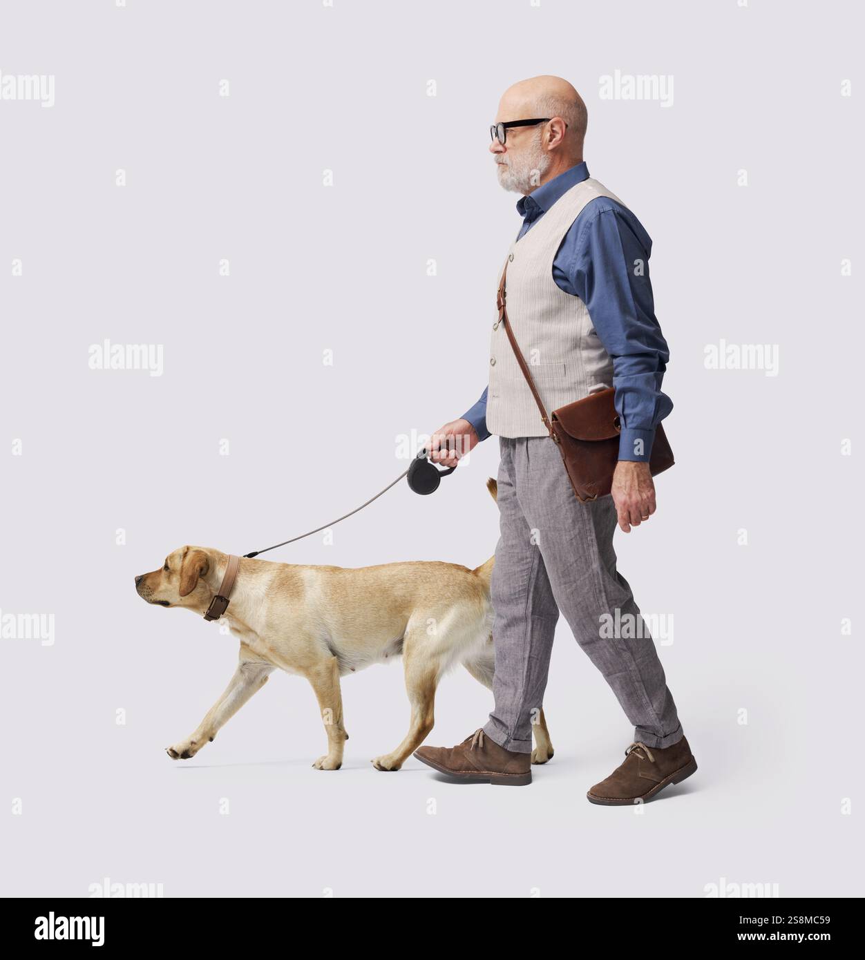 Confident mature man walking the dog, pets and lifestyle concept ...