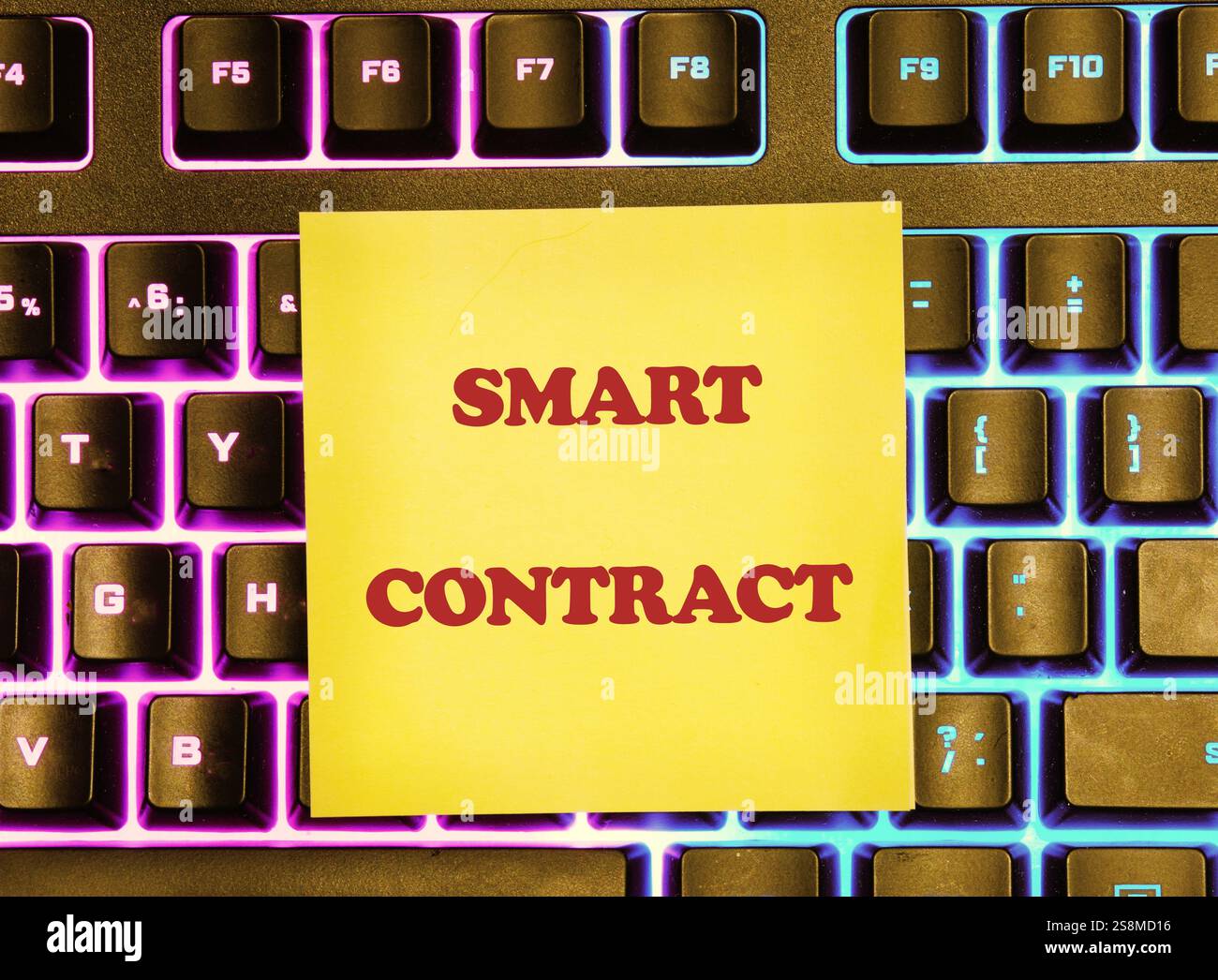 A bright office highlights a colorful backlit keyboard and a sticky ...