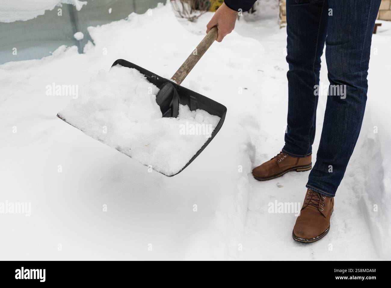 Removing snow shovel hi-res stock photography and images - Alamy