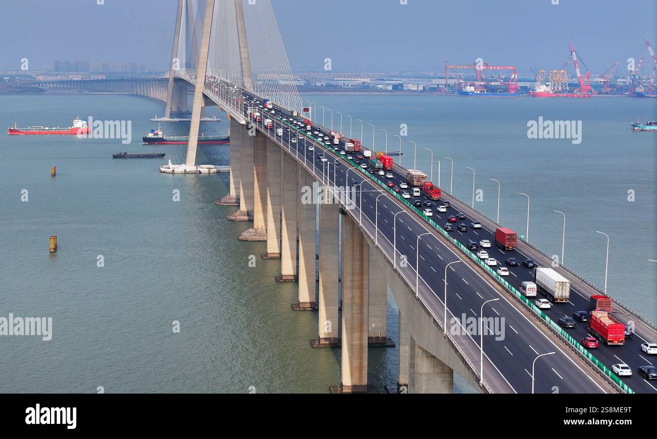 Traffic flows past the Sutong Bridge in Changshu city, East China's ...