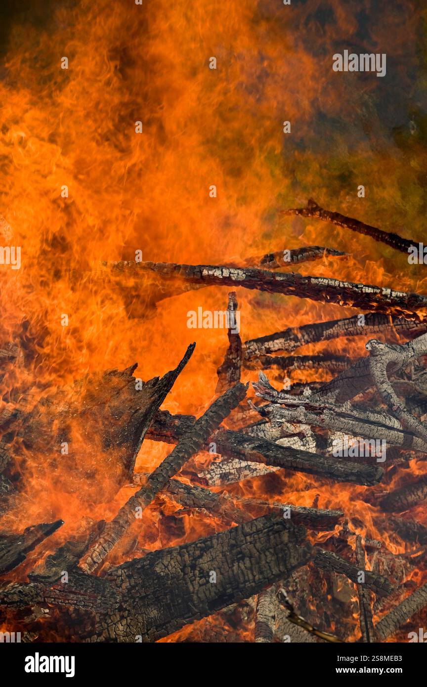 Burning a pile of garbage and rubbish in a bonfire fire pit for waste ...