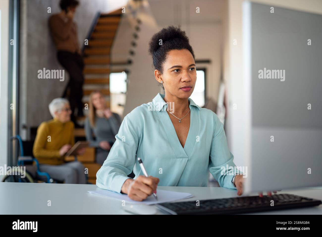 Black woman working in office and futuristic graphical user interface ...