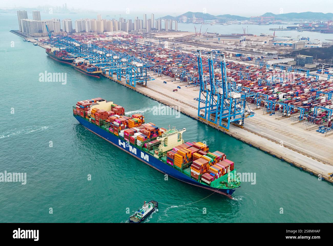 A foreign trade container ship leaves the fully automated terminal of Qingdao Port in Shandong ...