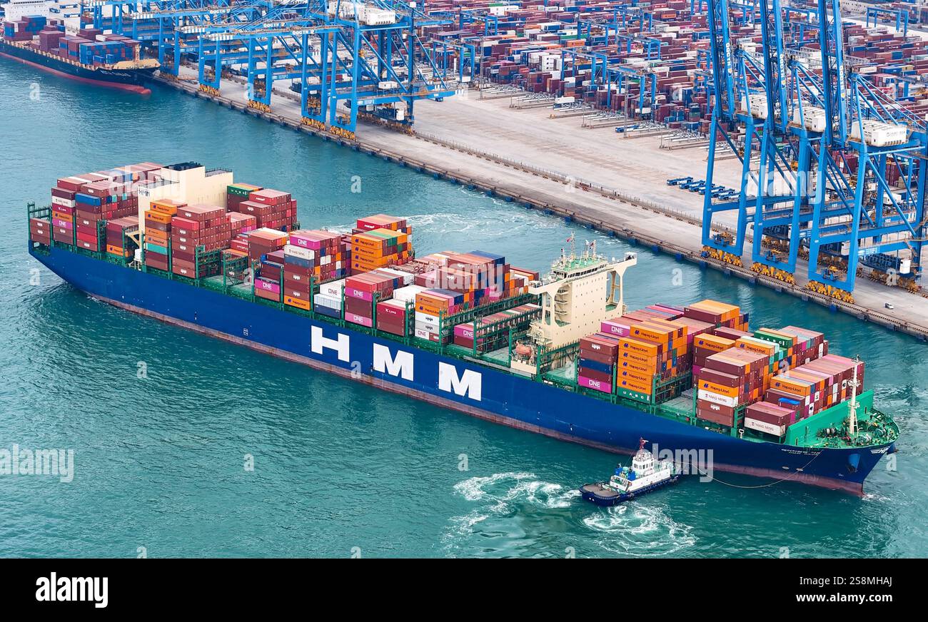 A foreign trade container ship leaves the fully automated terminal of ...