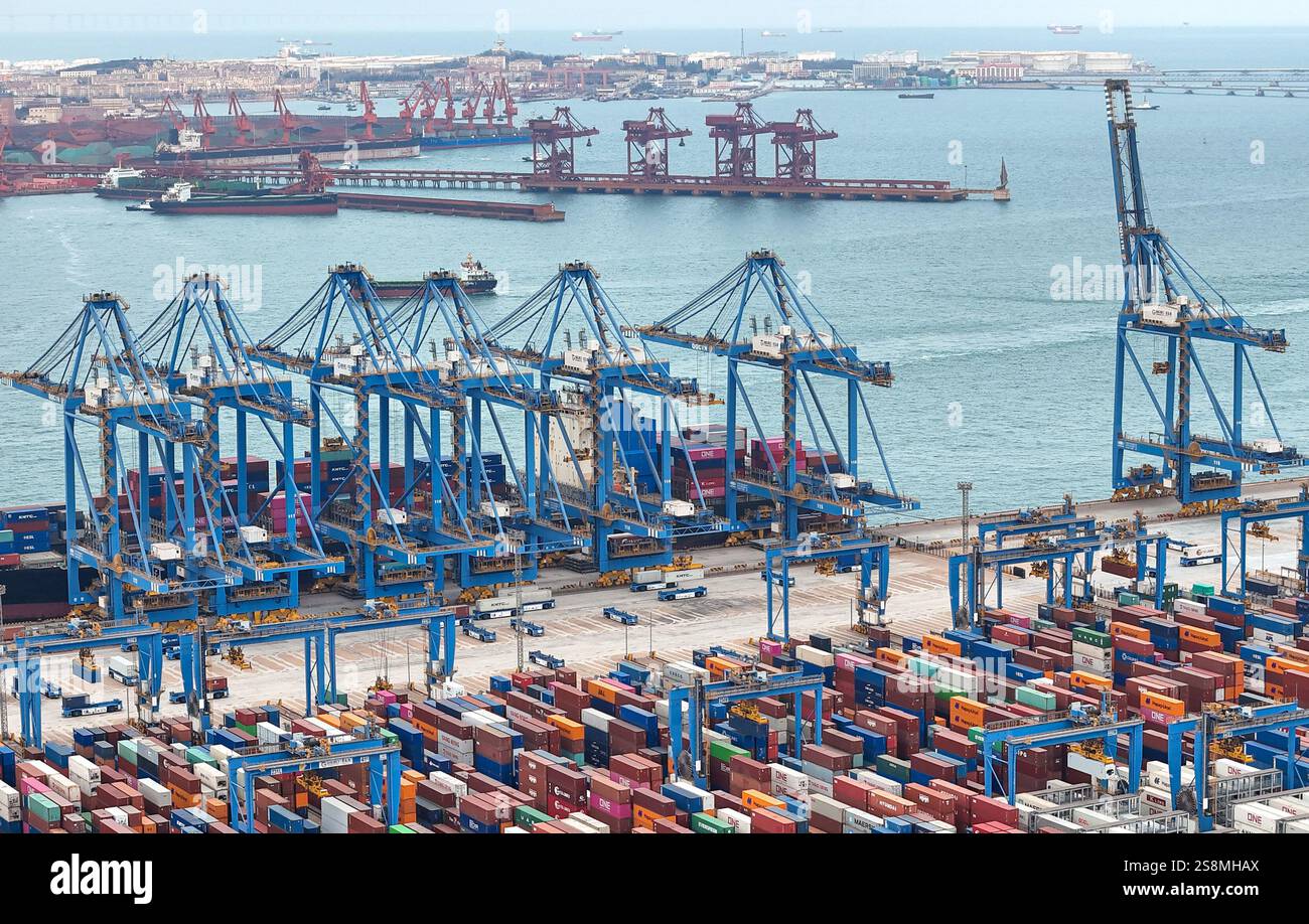 A foreign trade container ship is loading and unloading cargo at the fully automated terminal of ...