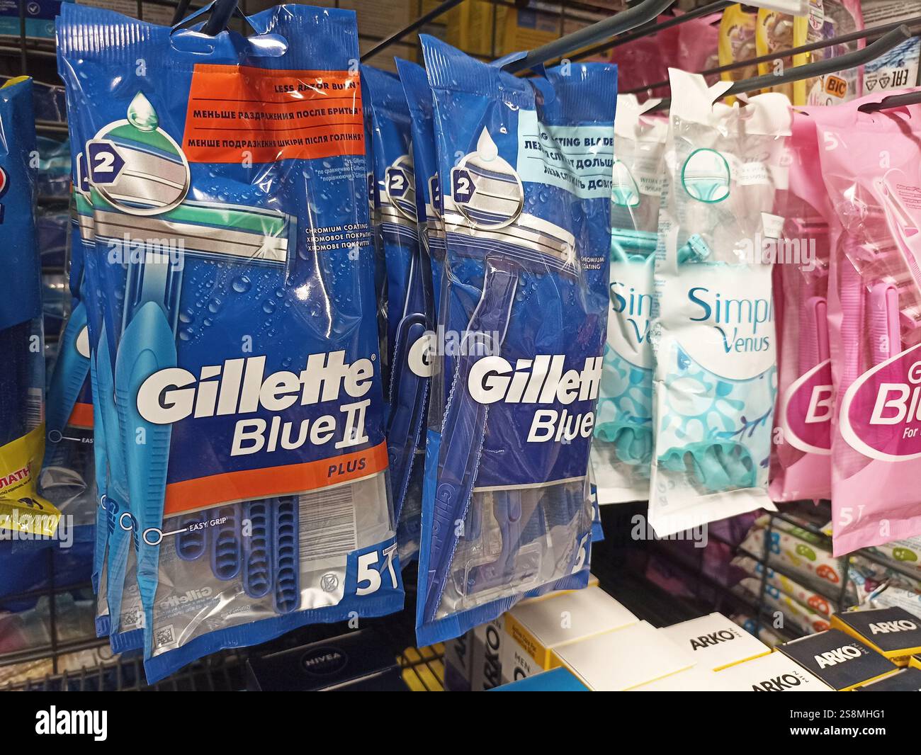 Assorted razors display on store shelf featuring gillette blue and ...