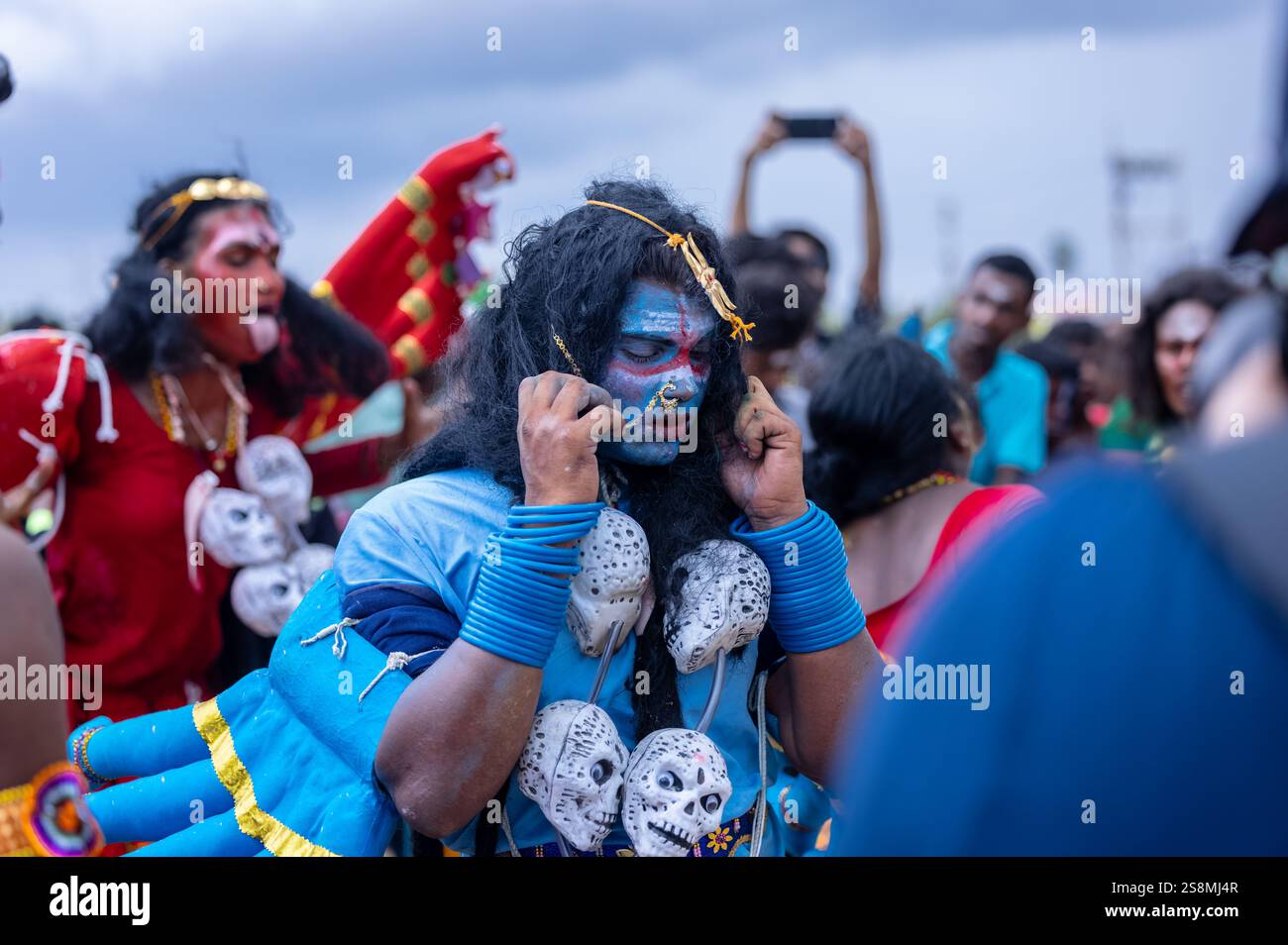 Kulasai, Portrait of indian hindu devotee with painted face and dressed ...