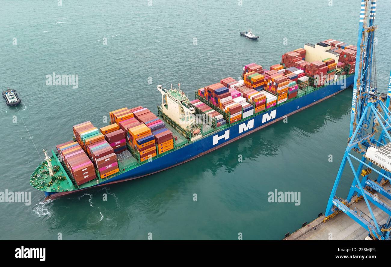 Qingdao, China. 23rd Jan, 2025. A foreign trade container ship leaves ...