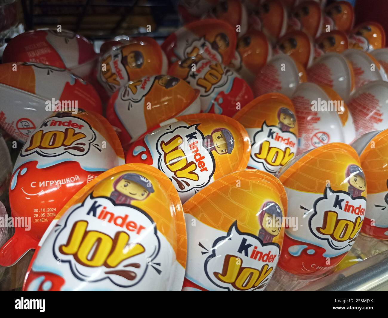 Kinder joy chocolate eggs with toy surprise in store shelf display ...