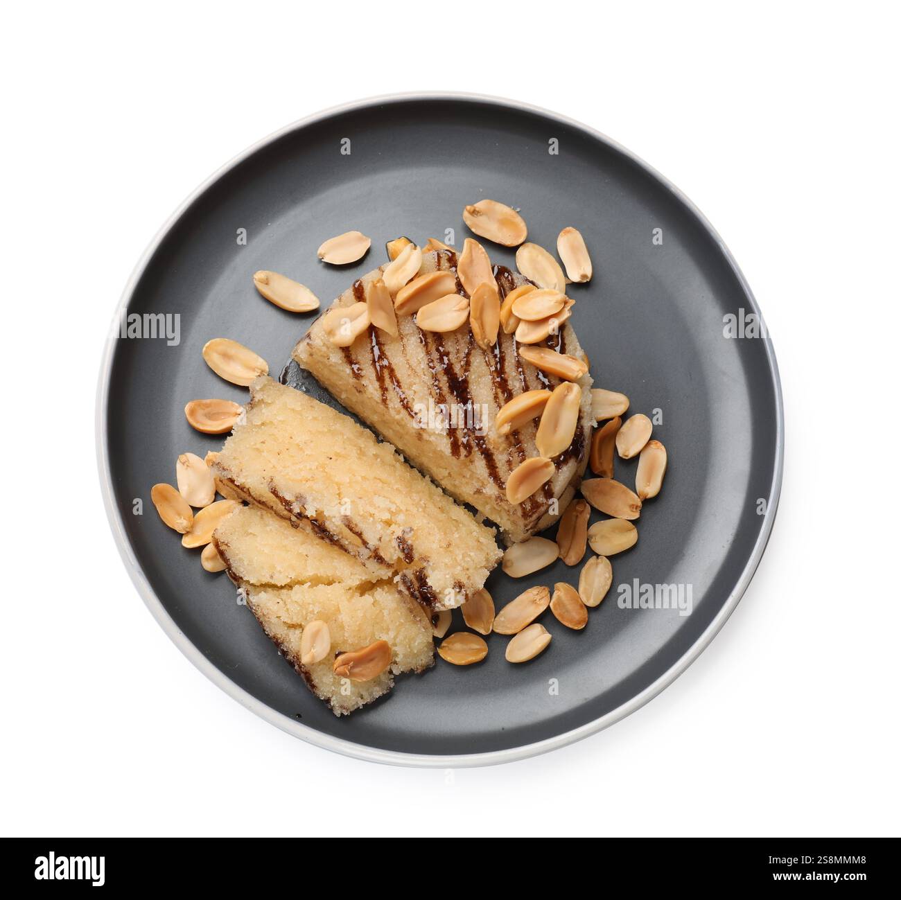 Delicious sweet semolina halva with peanuts isolated on white, top view ...