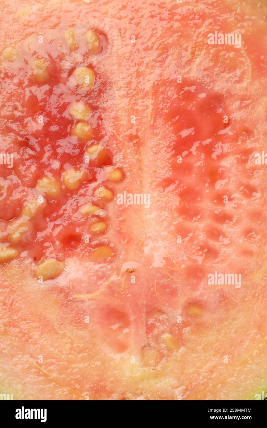 Juicy guava fruit with seeds as background, top view Stock Photo - Alamy