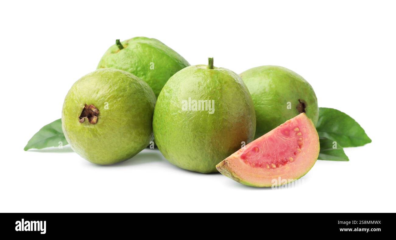 Fresh whole and cut guava fruits with leaves isolated on white Stock ...