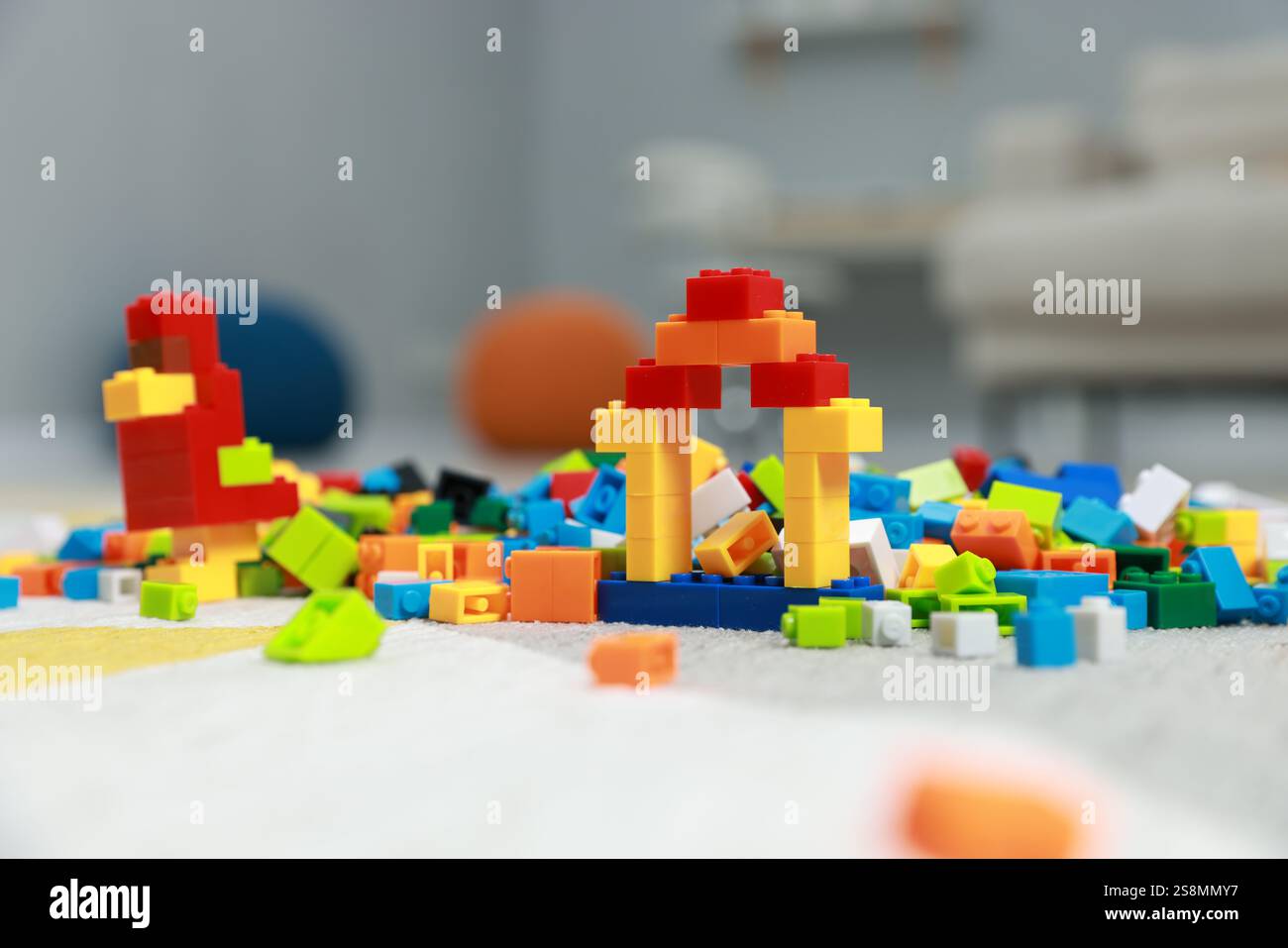 Construction toy. Figures made with building bricks and colorful blocks ...