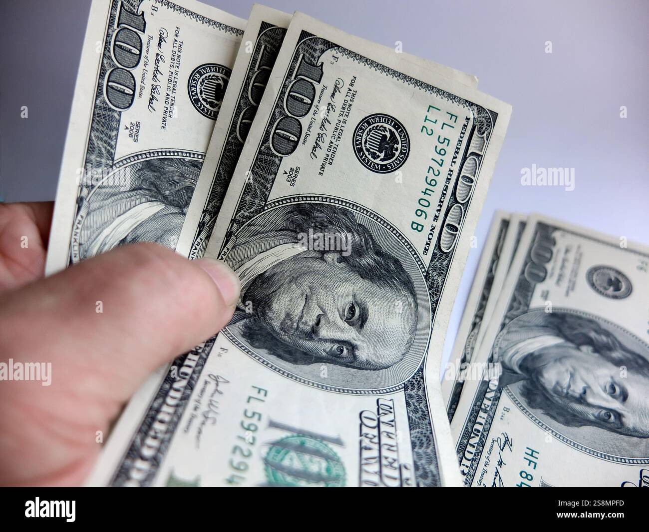 Close-up cash, 100 hundred dollar bills, 50 dollar bills, 20 dollar ...